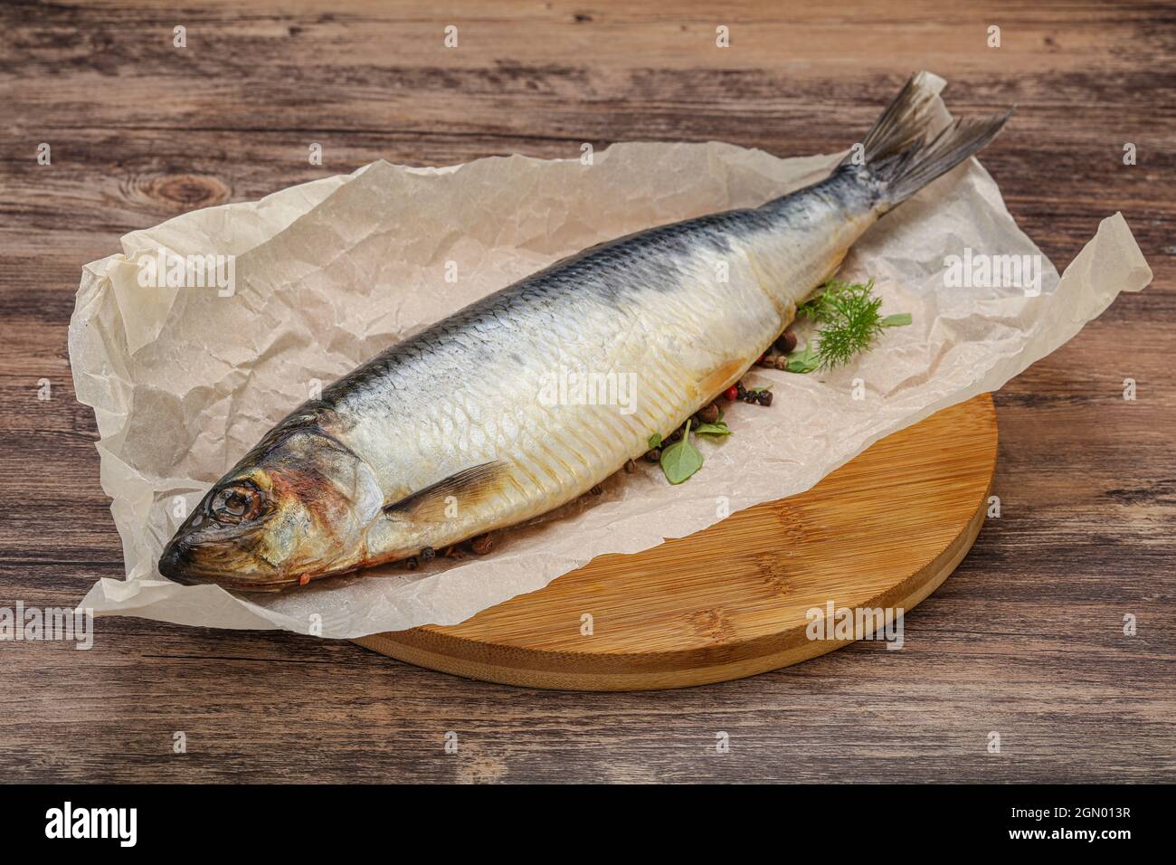 Salted Herring fish with pepper and spices Stock Photo - Alamy