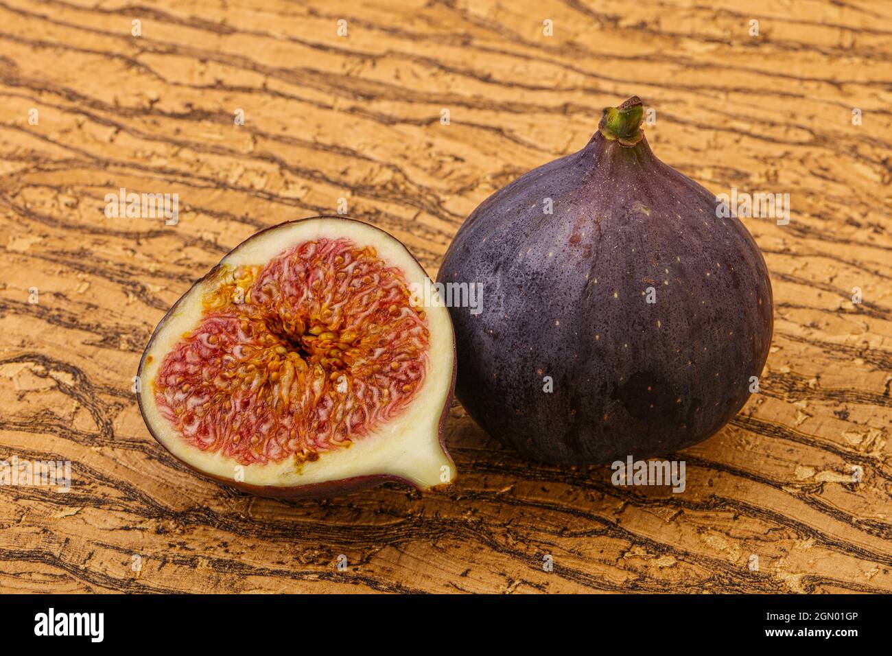 Sweet purple slice of fig fruit Stock Photo - Alamy