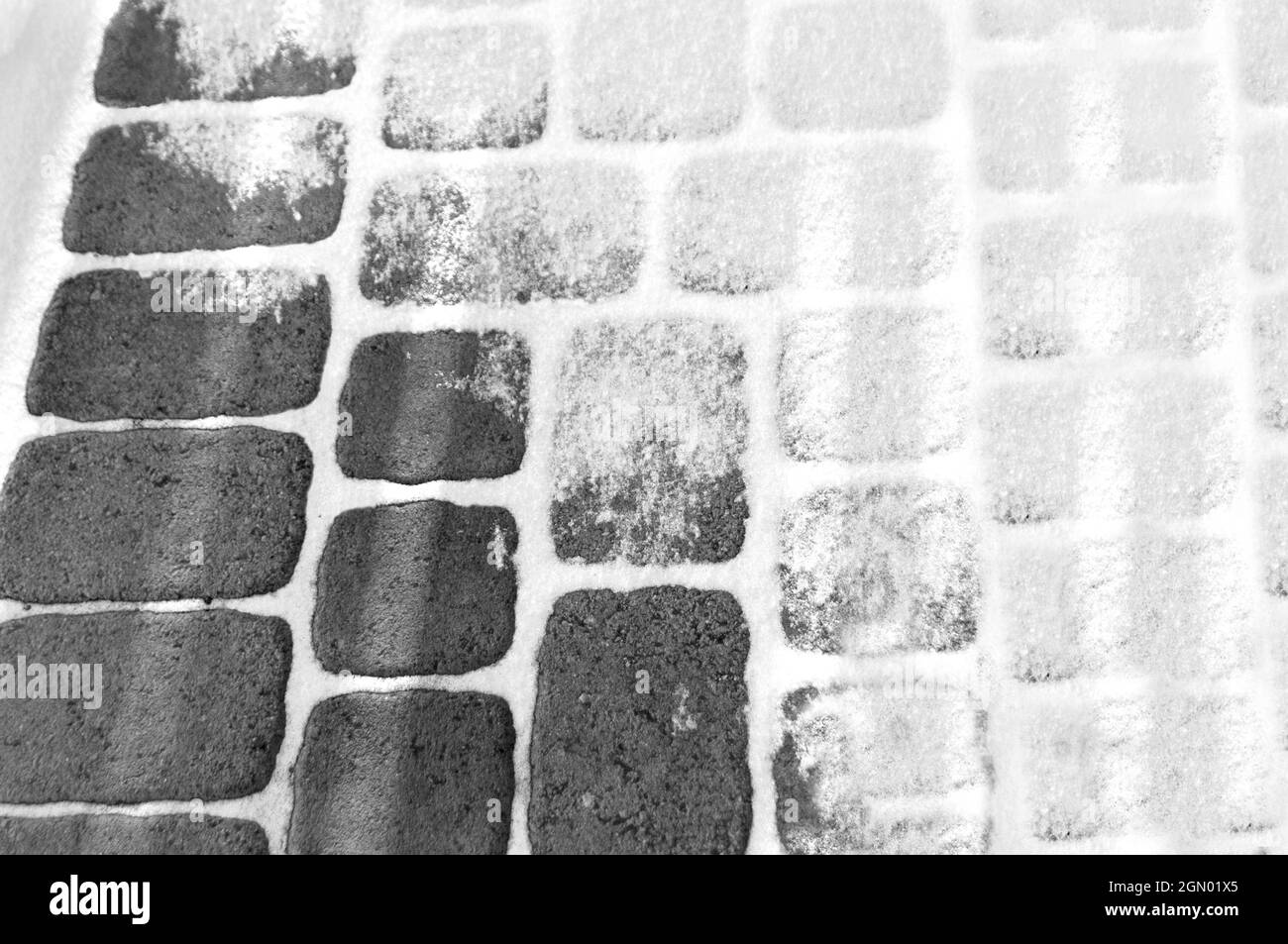 Black and white, background image of a brick walk covered in snow Stock ...