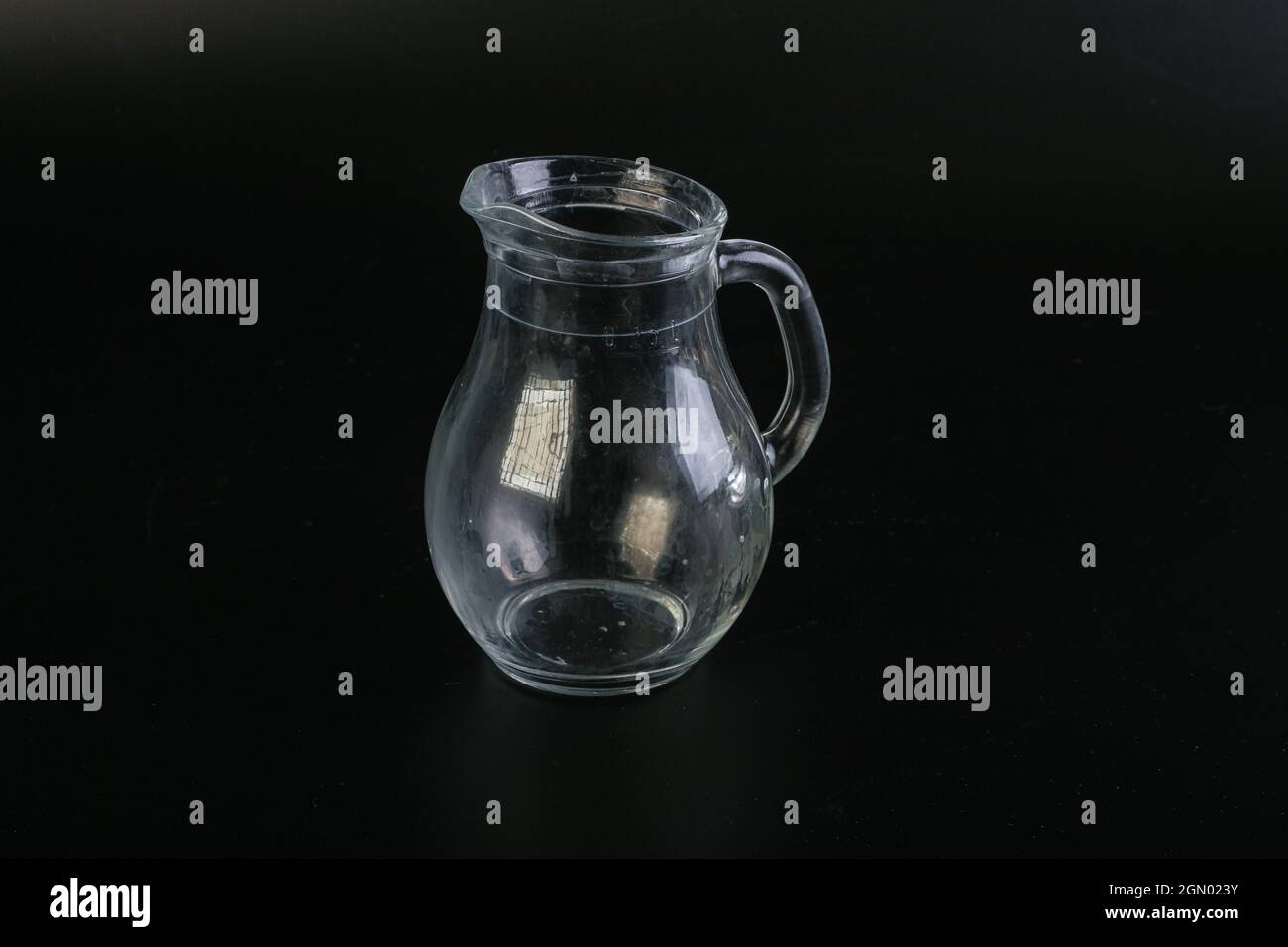 Empty glass jug for liquid isolated Stock Photo - Alamy