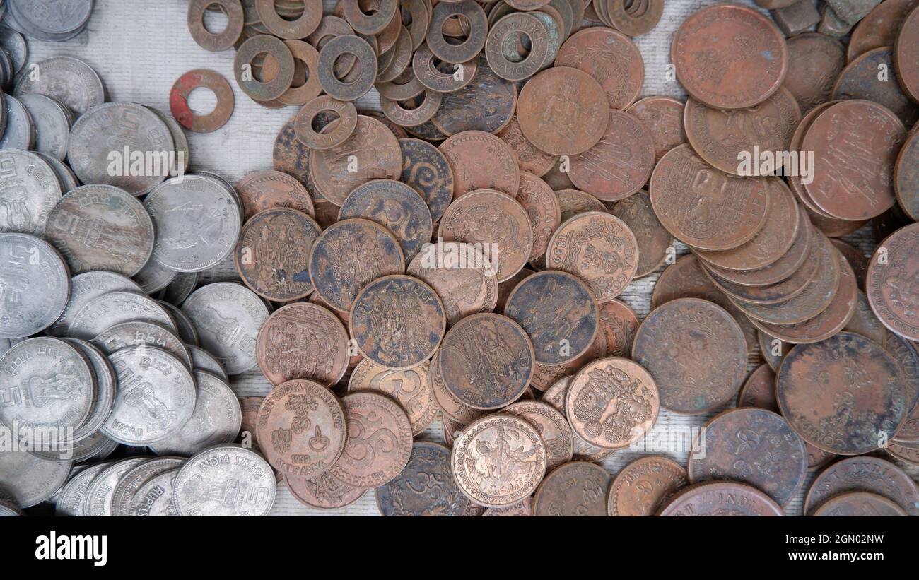 Brass Coins of Half Anna with one paise and five rupees coins. Old ...
