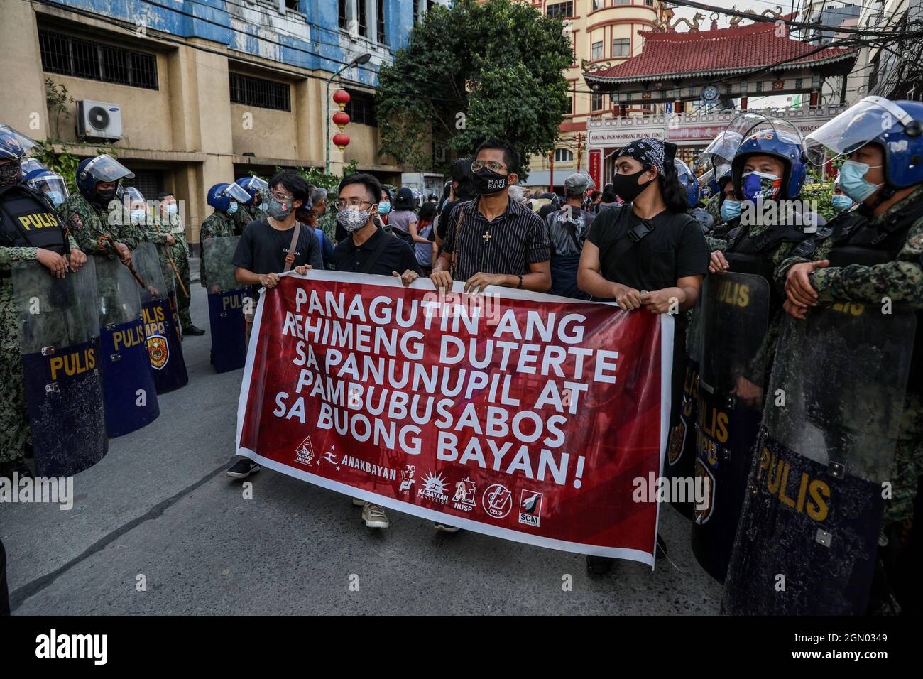 September 21, 2021: Anti-riot police block activists holding signs ...