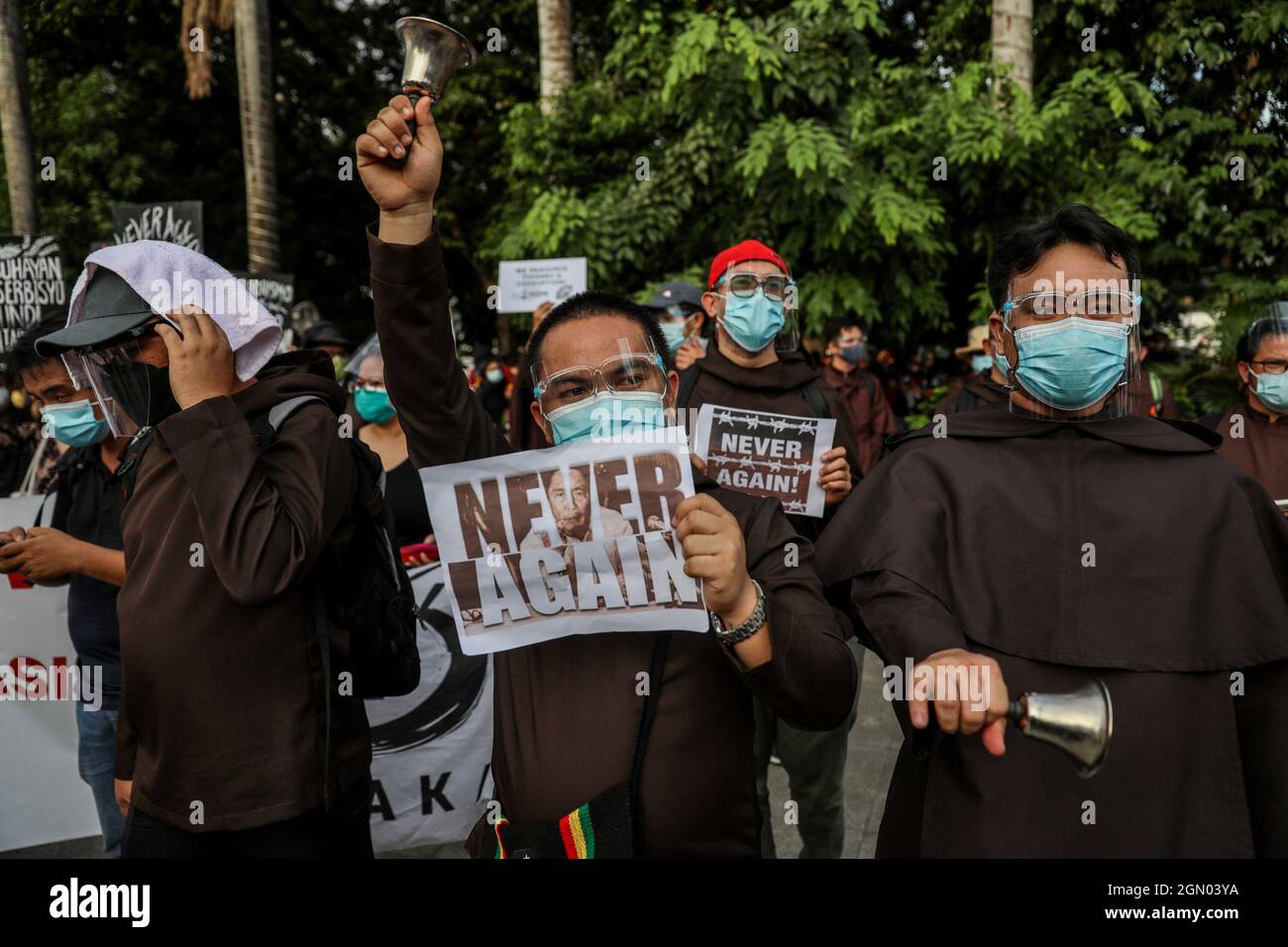 September 21, 2021: Members of the church hold signs during a protest ...