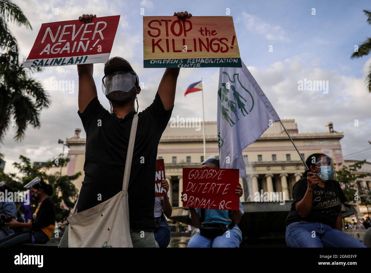 September 21, 2021: An activist holds placards during a protest in ...