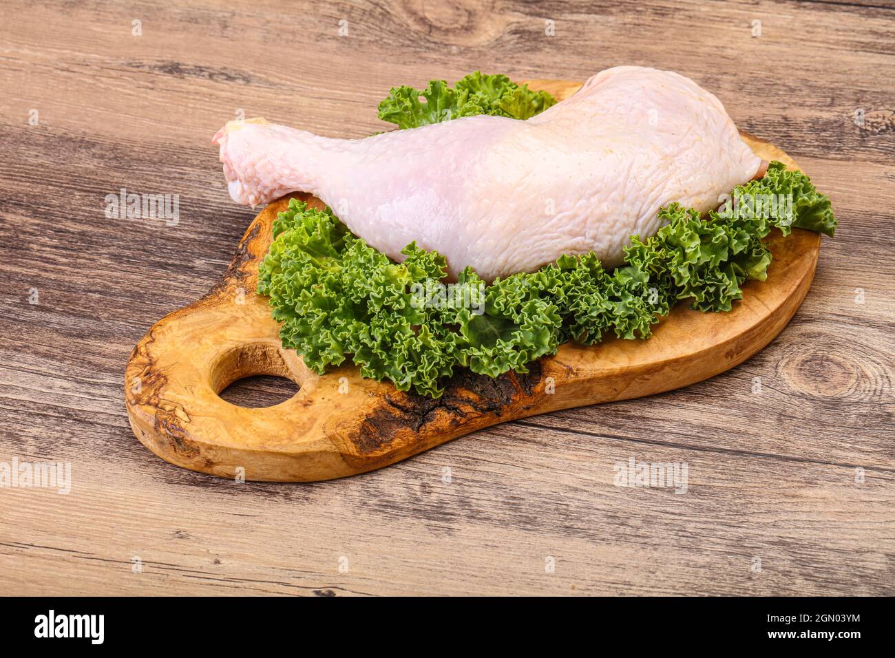 Raw uncooked chicken leg for cooking Stock Photo - Alamy