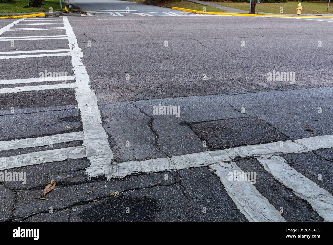 Low view of street intersection with crosswalks marked in layers of ...