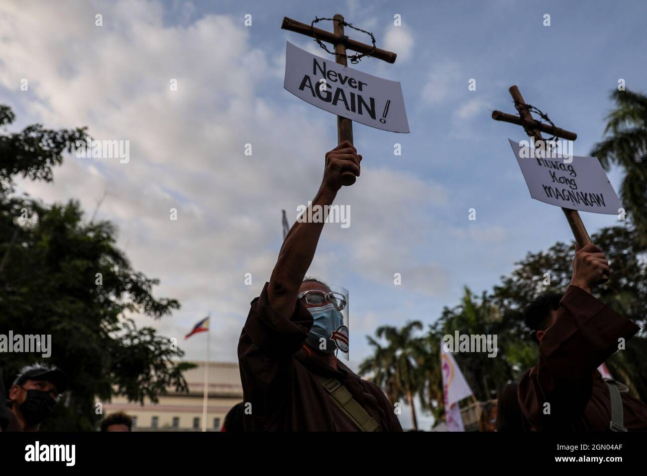 September 21, 2021: Members of the church hold signs during a protest ...