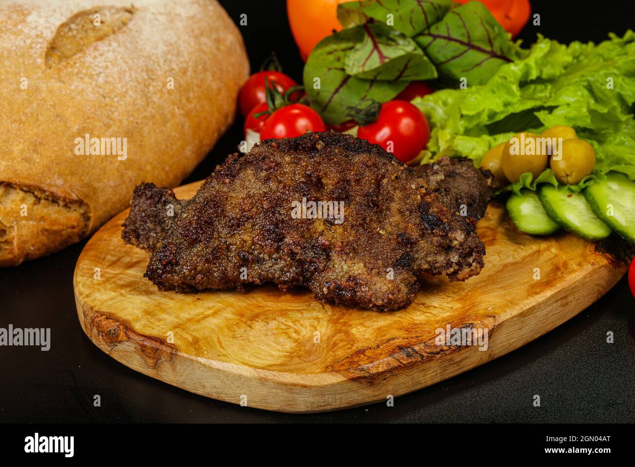 Roasted hot pork liver steak isolated Stock Photo - Alamy