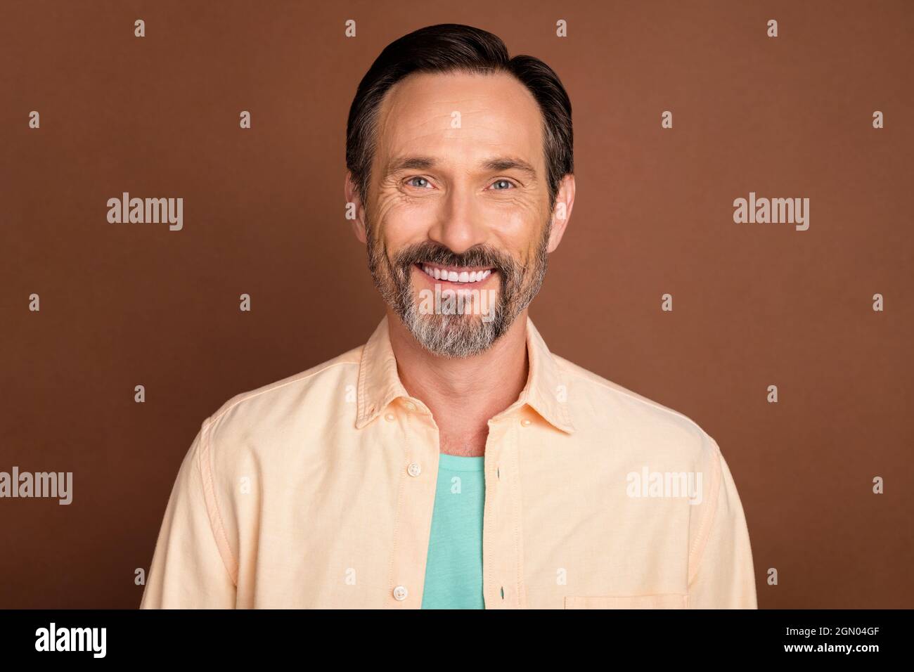 Photo of cheerful positive bearded man toothy beaming smile wear beige ... Photo of cheerful positive bearded man toothy beaming smile wear beige ...