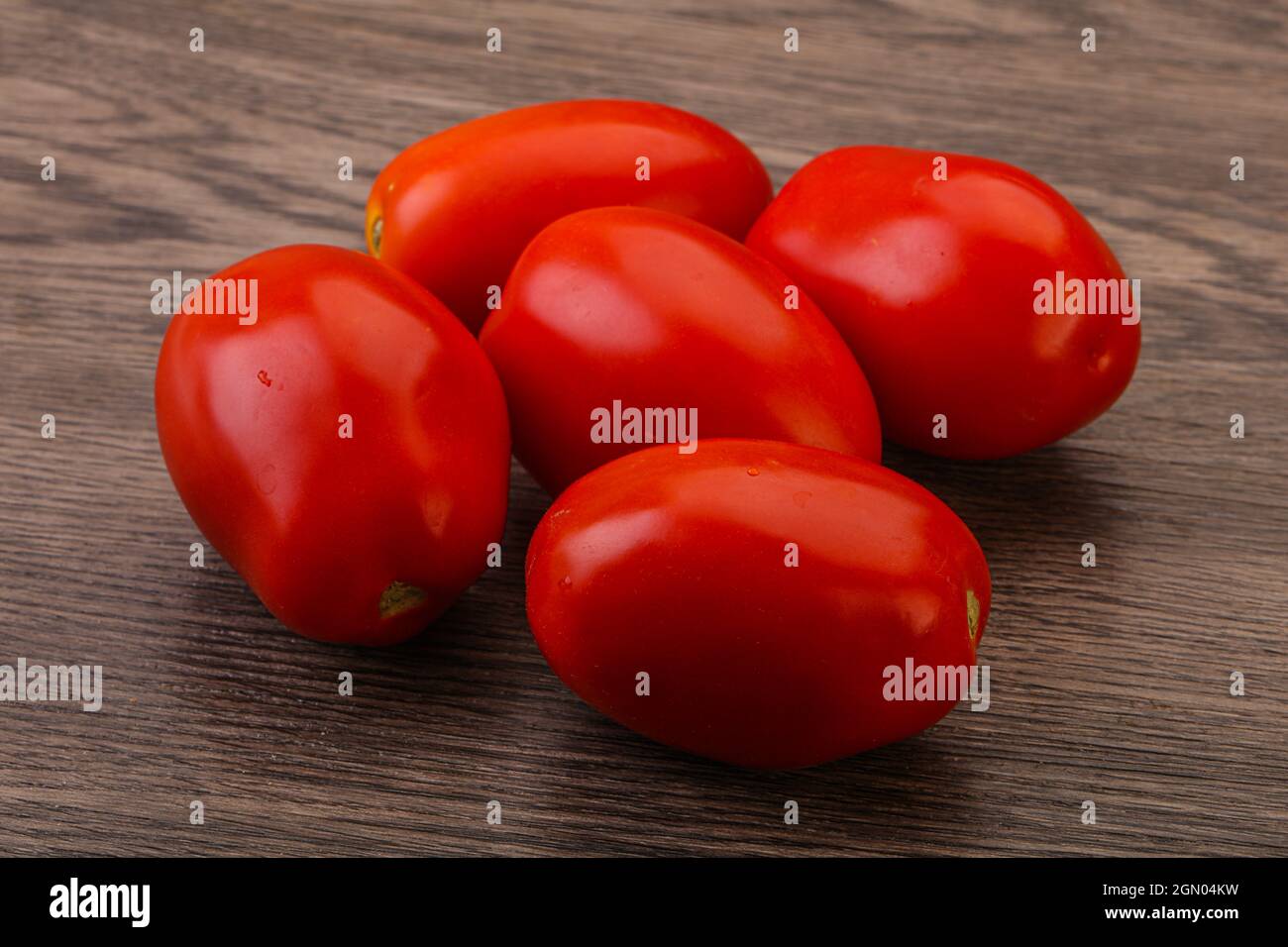 Few Red bright tasty tomato heap Stock Photo - Alamy