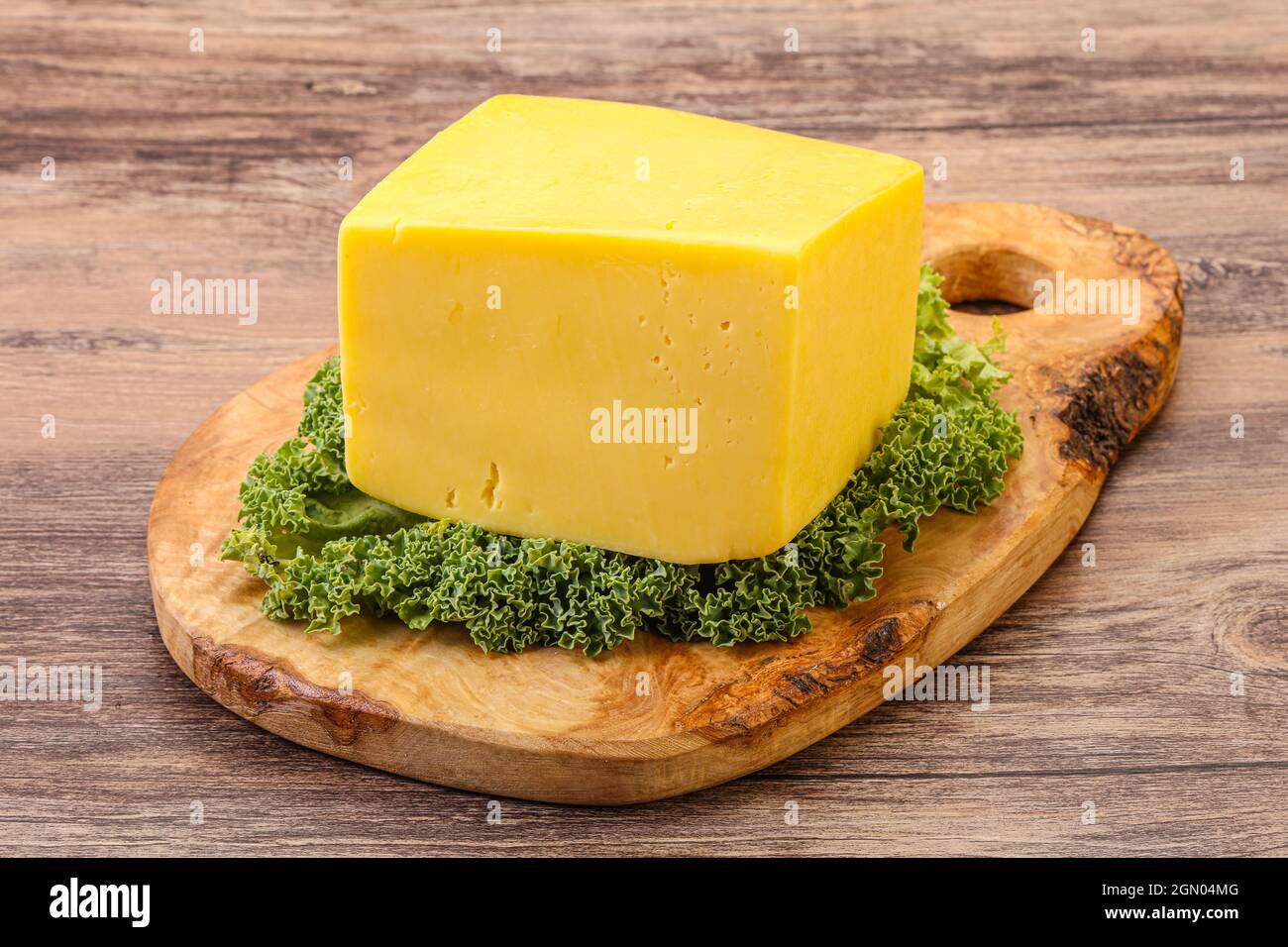 Yellow tilsiter cheese dairy product brick Stock Photo - Alamy
