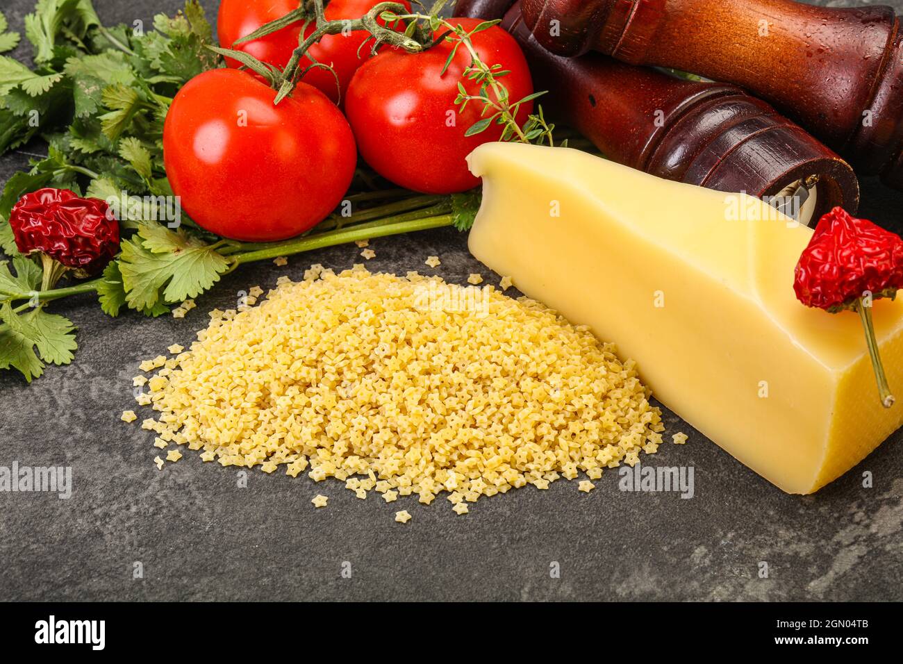 Raw Italian pasta - Stelline for cooking served vegetables Stock Photo ...