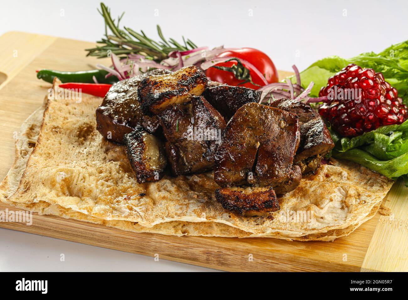 Lamb liver barbeque with fat served salad Stock Photo - Alamy