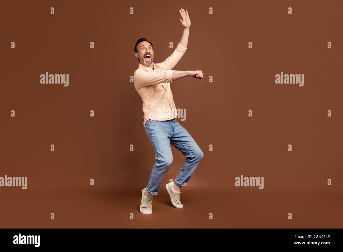 Photo of crazy funky guy dance imagine ride horse wear beige shirt ...