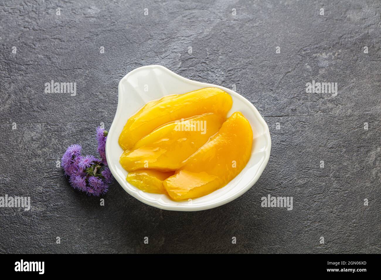 Sweet canned tropical fruit mango slices Stock Photo - Alamy