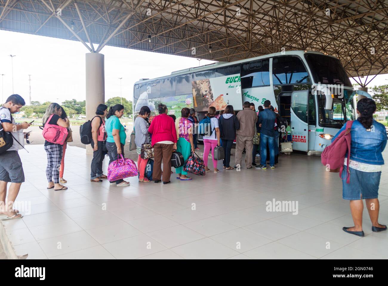 BOA VISTA, BRAZIL - AUGUST 12, 2015: People entering the bus to Caracas ...