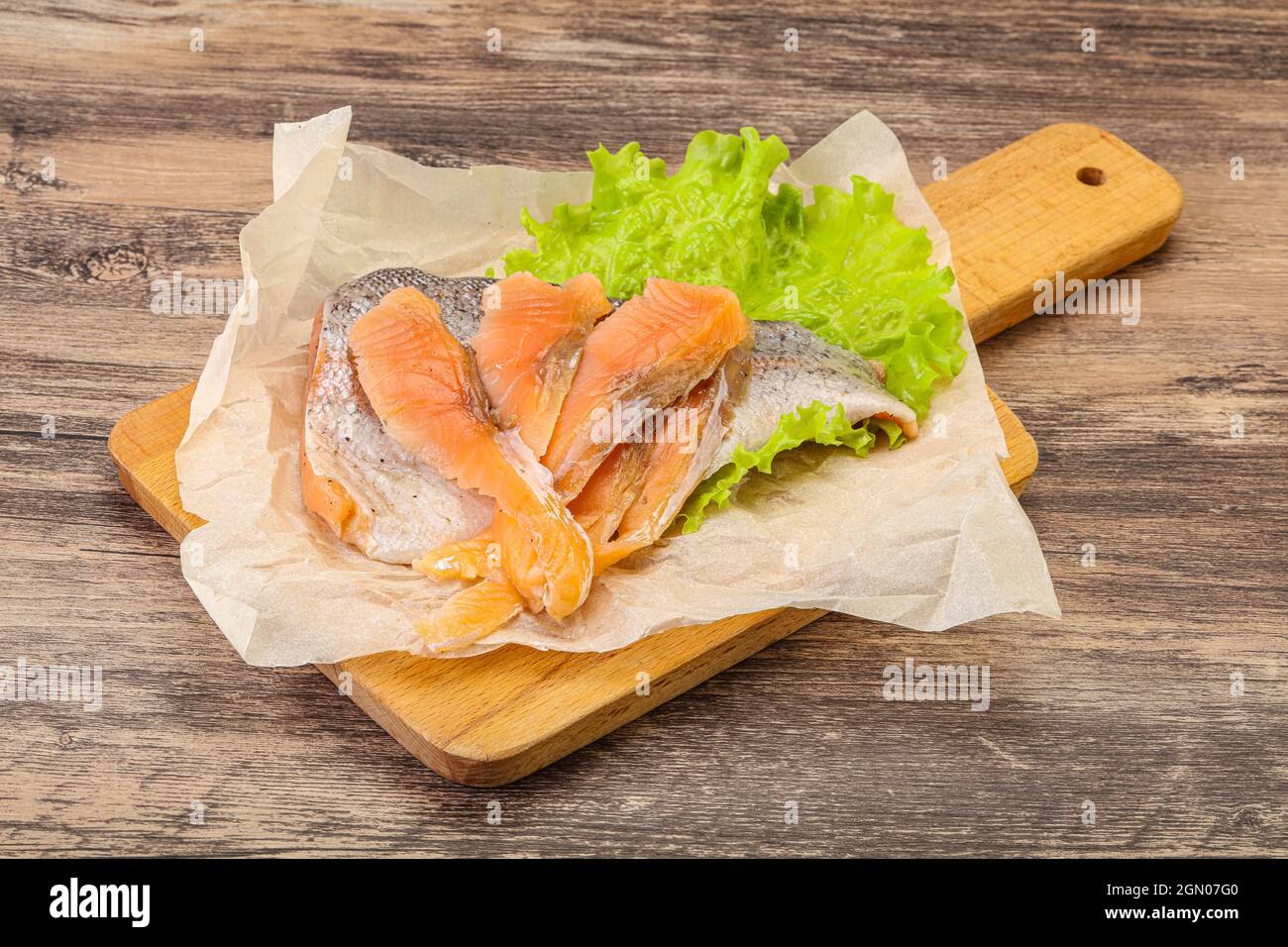 Sliced natural wild trout fillet over board Stock Photo - Alamy