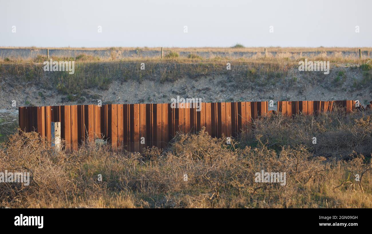 Crumbling iron sea defences seen in Pagham, UK Stock Photo - Alamy