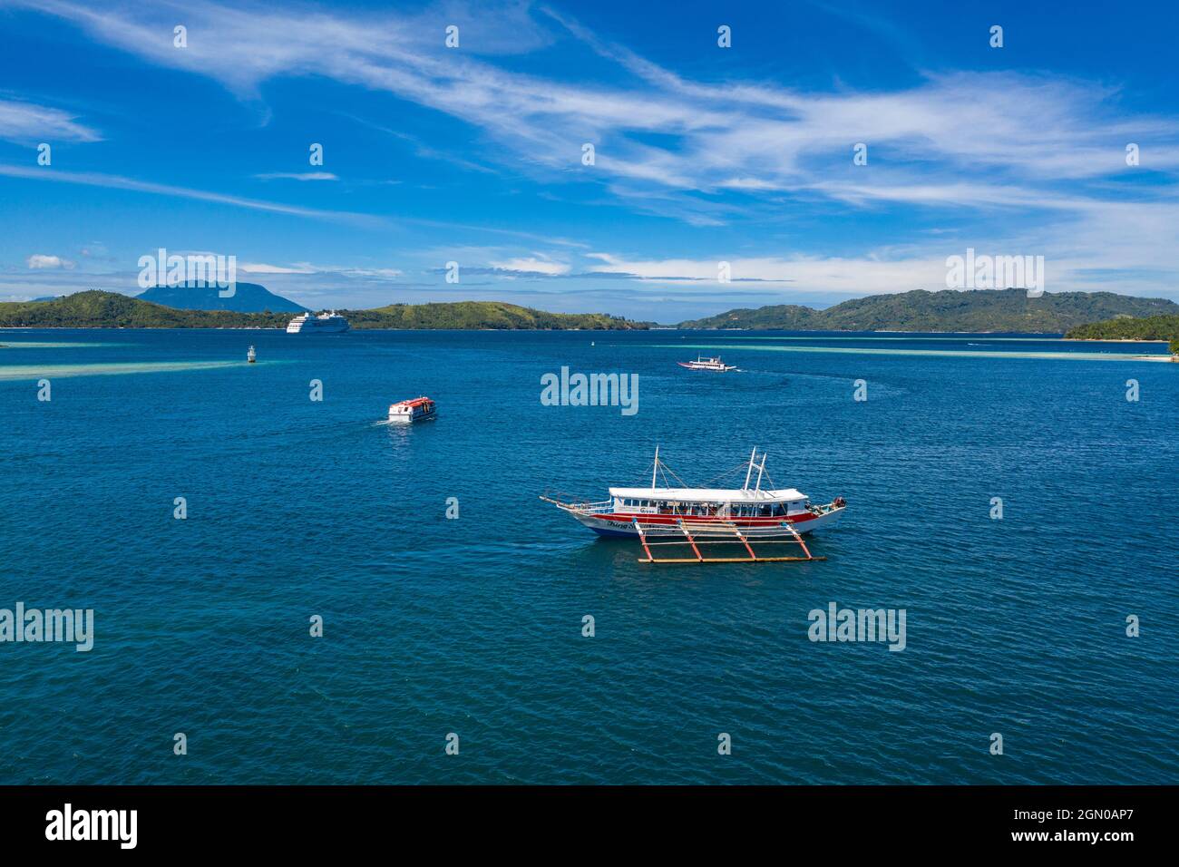 Aerial view of a traditional Filipino Banca outrigger canoe tour boat ...