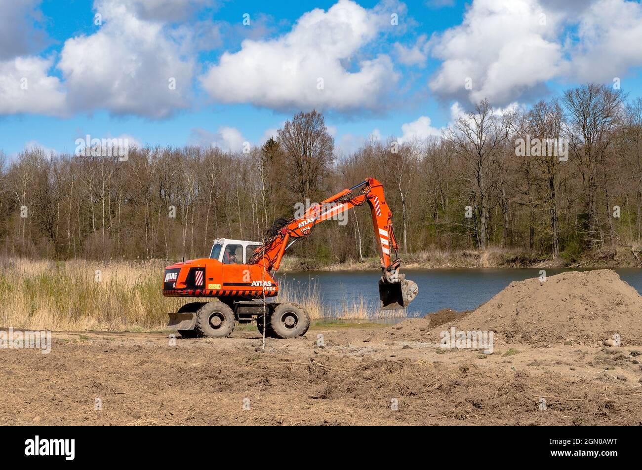 Kaliningrad Region, Russia, April 24, 2021. Excavator digging the ...