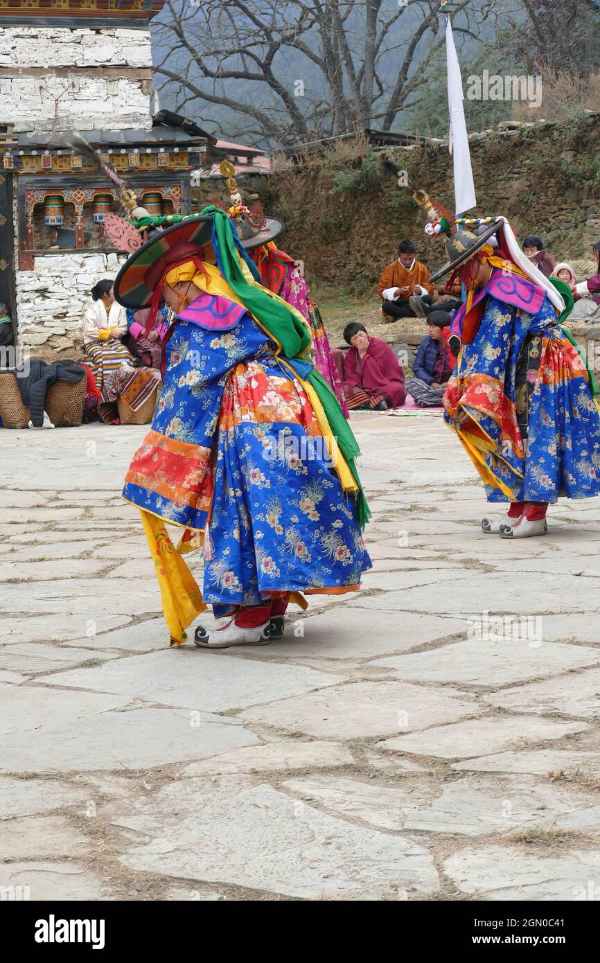 BUMTHANG, BHUTAN - Dec 13, 2019: The traditionally dressed dancers ...