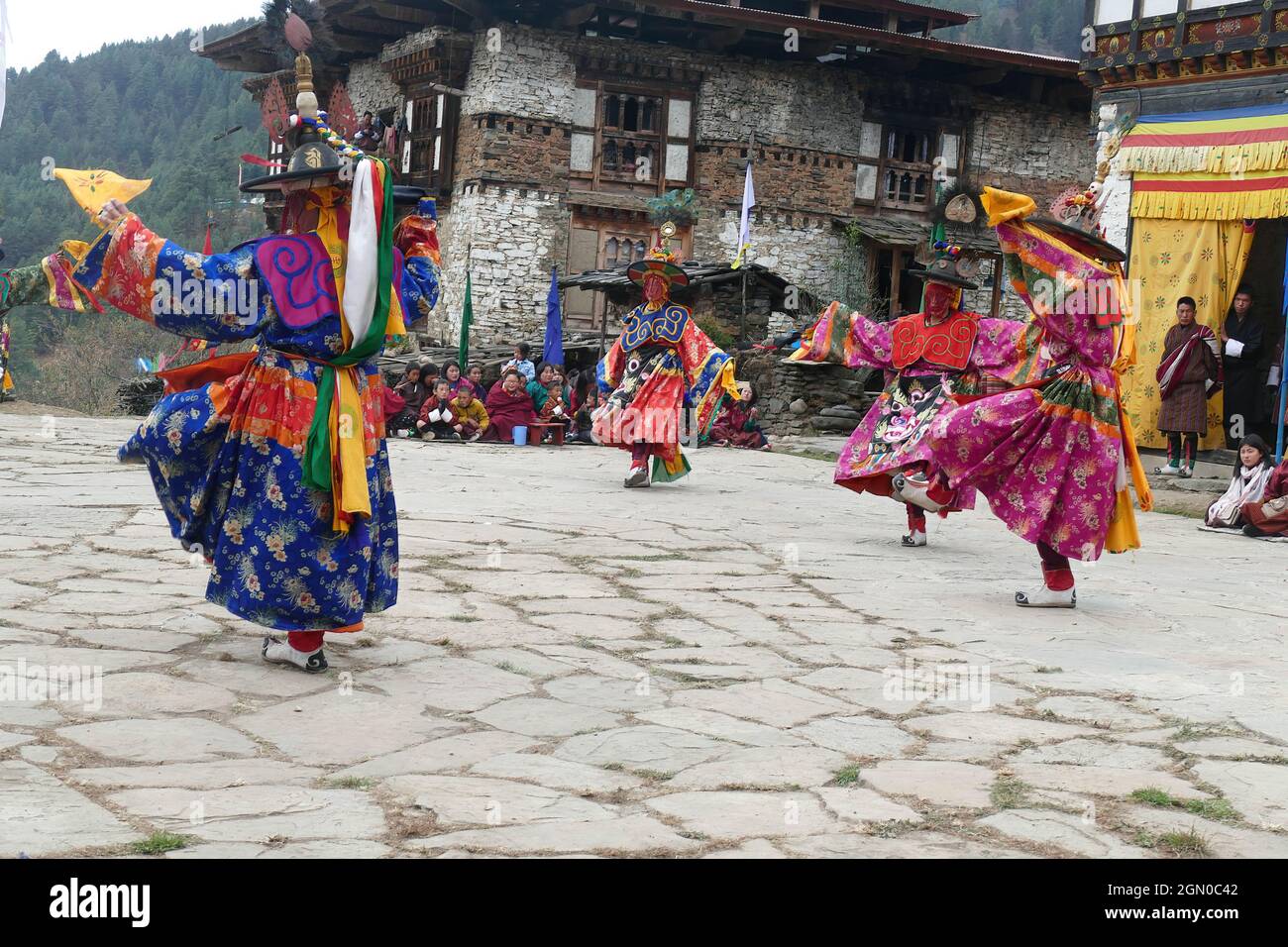 BUMTH ANG, BHUTAN - Dec 13, 2019: The traditionally dressed dancers ...
