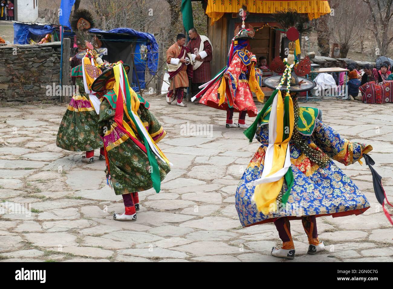 BUMTH ANG, BHUTAN - Dec 13, 2019: The traditionally dressed dancers ...