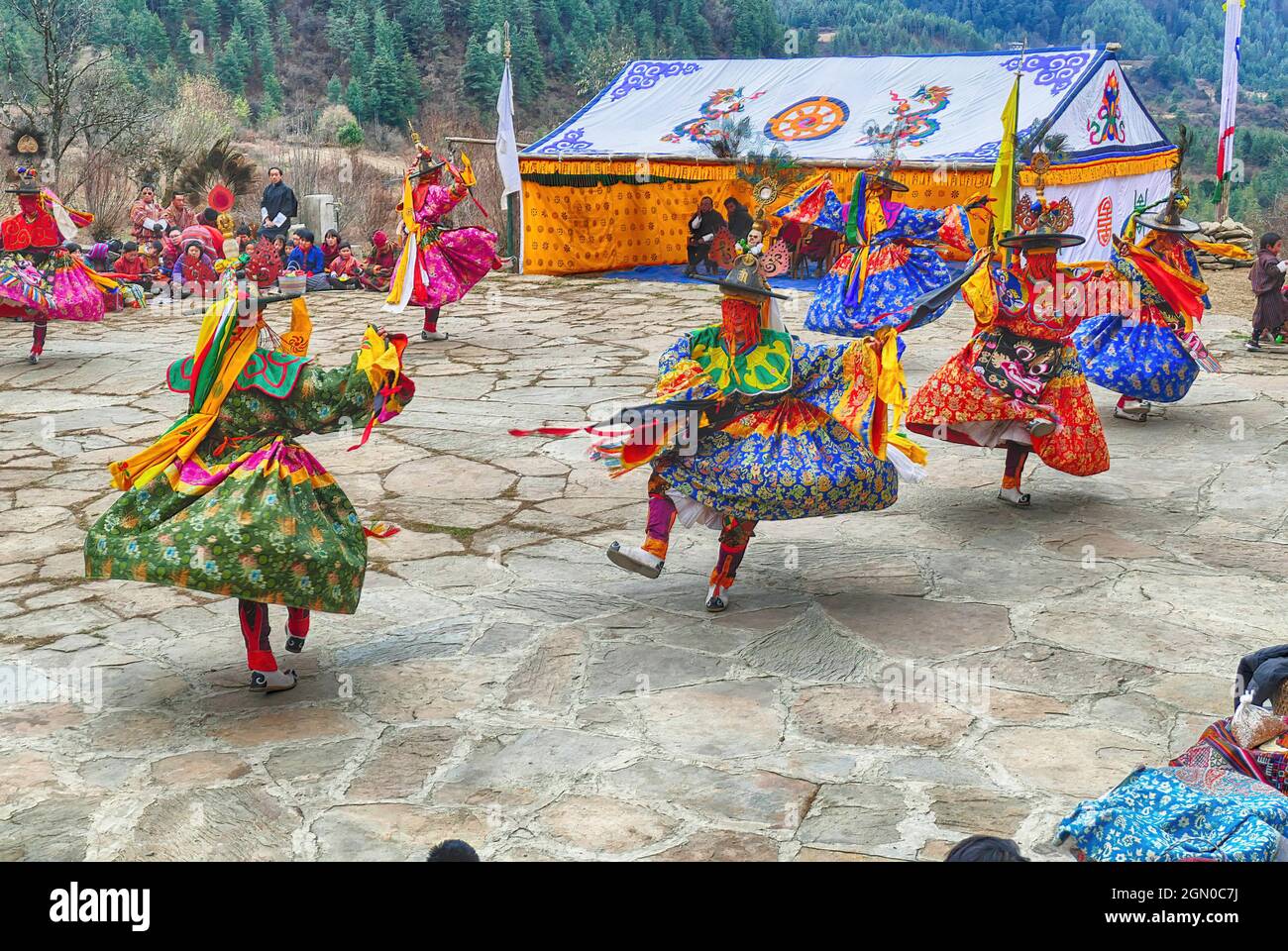 BUMTH ANG, BHUTAN - Dec 13, 2019: The traditionally dressed dancers ...