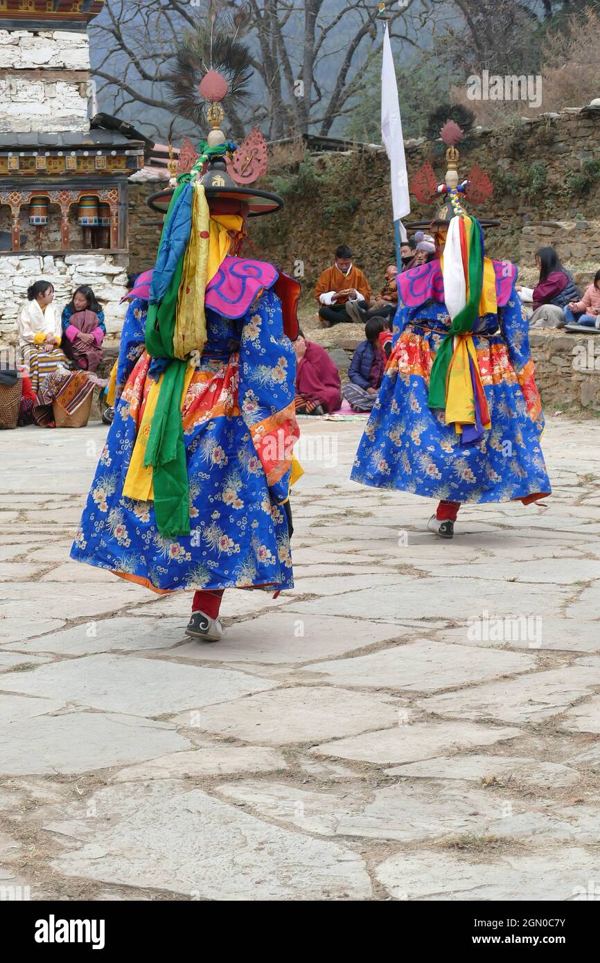 BUMTH ANG, BHUTAN - Dec 13, 2019: The traditionally dressed dancers ...