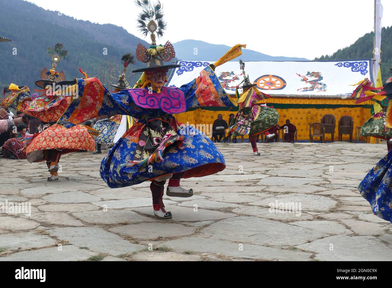 BUMTHANG, BHUTAN - Dec 13, 2019: The traditionally dressed dancers ...