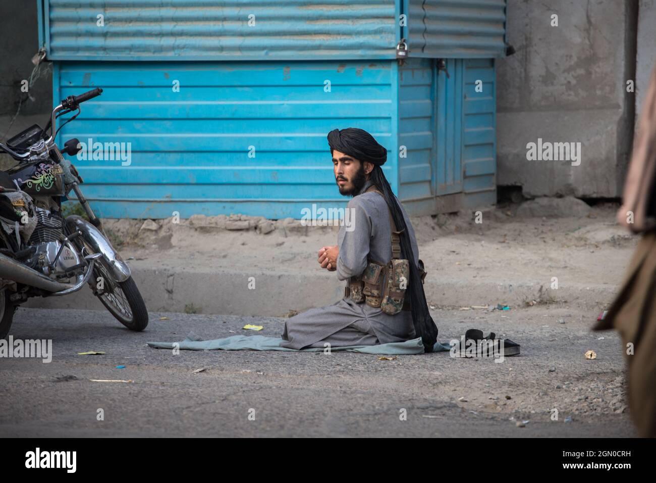 EDITORIAL USE ONLY - Taliban praying in the street s of Kabul, in the ...