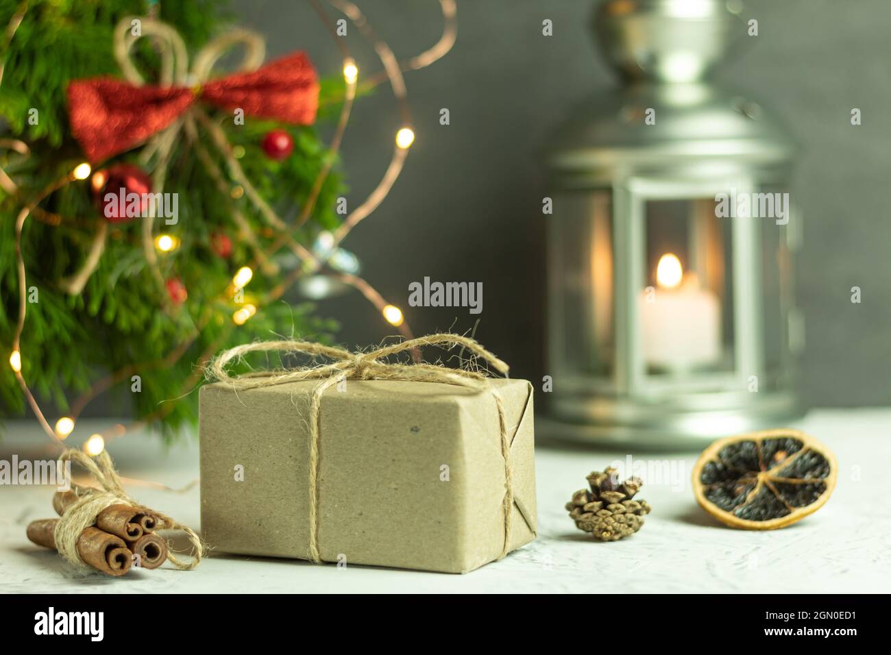 A Christmas gift wrapped in eco paper. Eco-friendly gift wrapping in ...