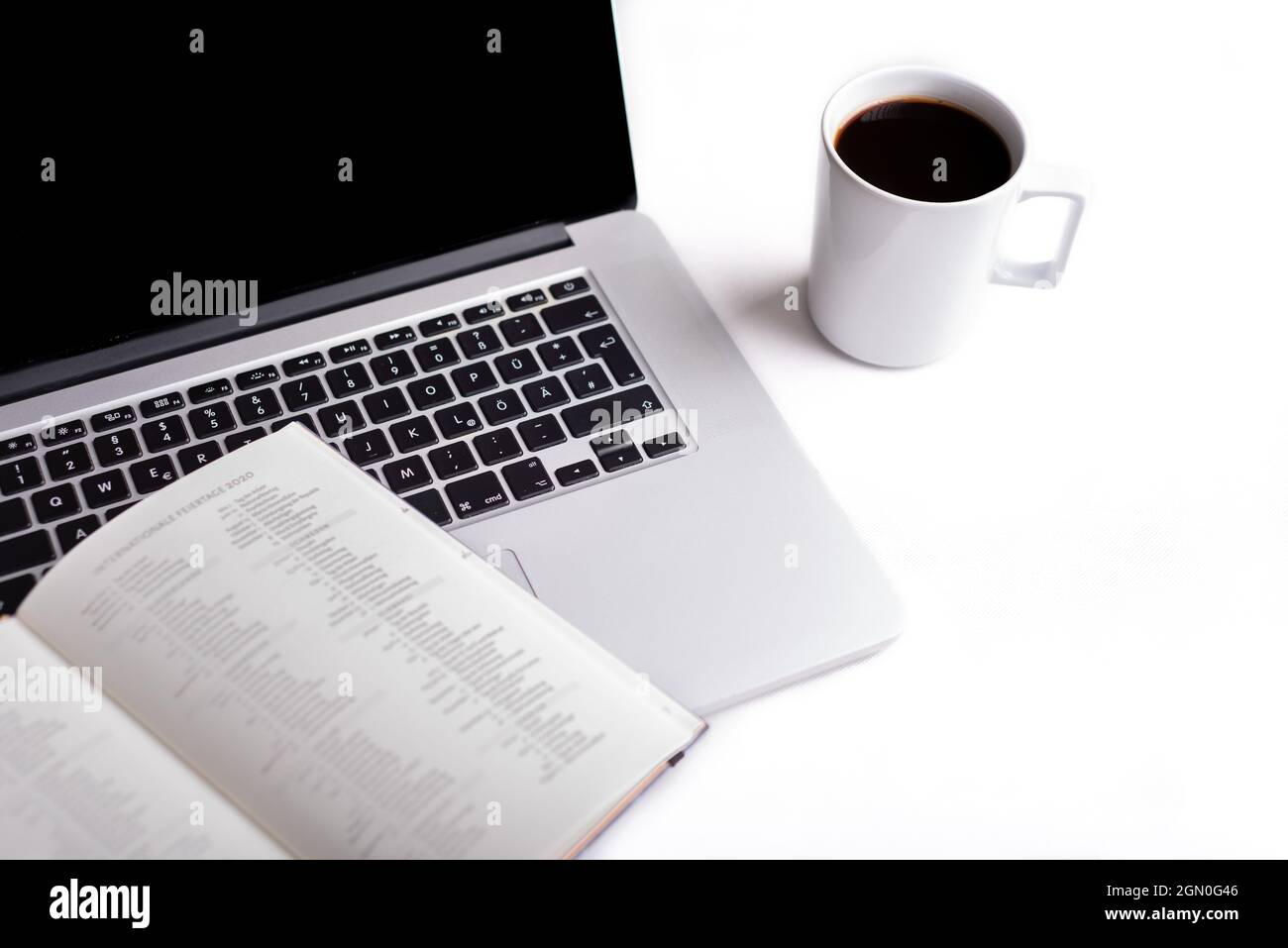 work office desk with a cup of coffee computer laptop, notebook Stock ...