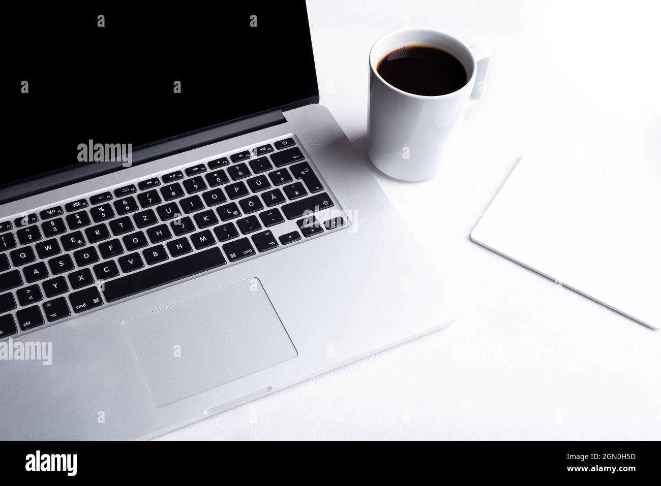 work office desk with a cup of coffee computer laptop Stock Photo - Alamy