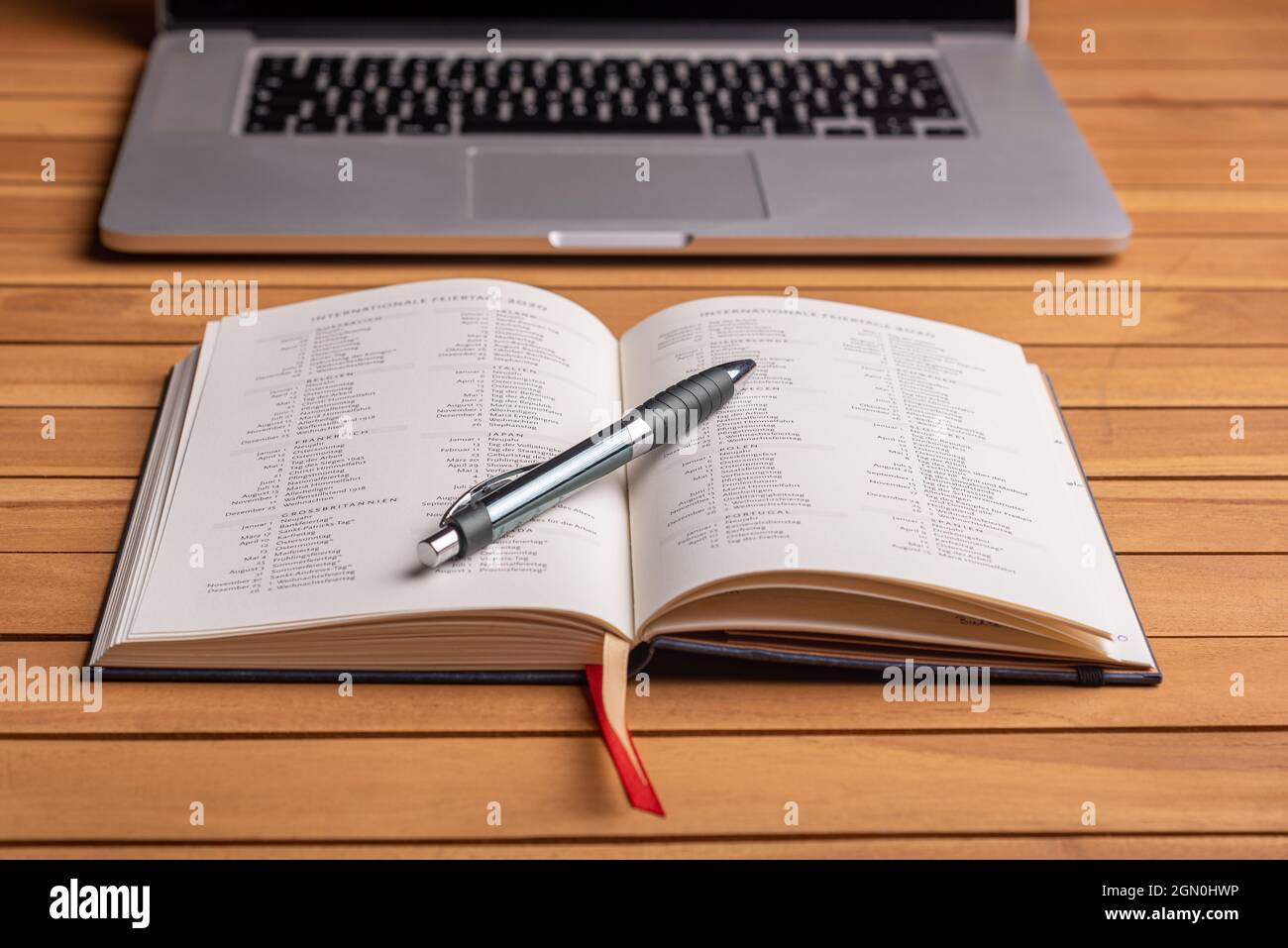 work office desk with a computer laptop, notebook, pen Stock Photo - Alamy