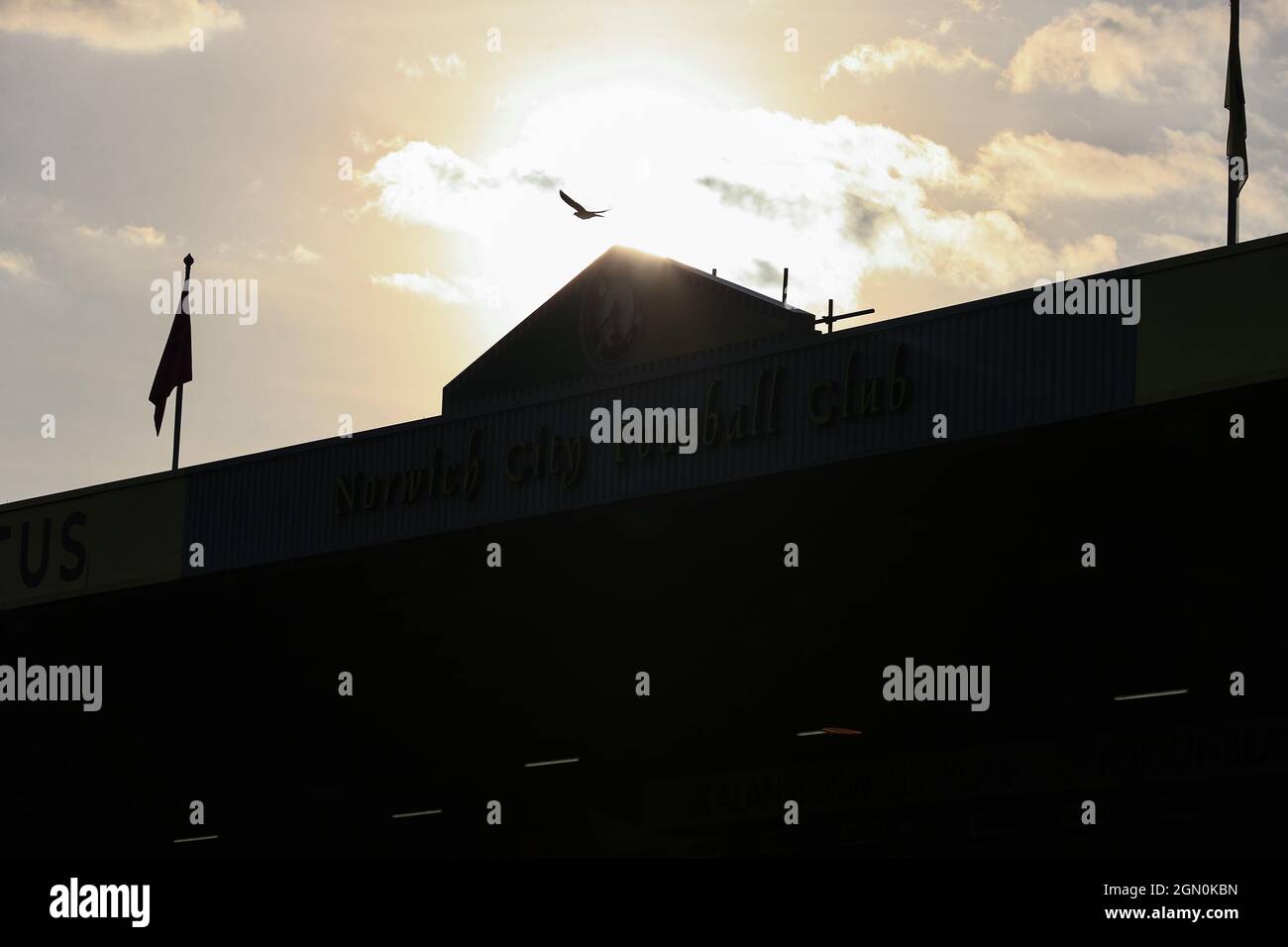 A seagull fly’s past through a sun burst over the clock tower at Carrow ...