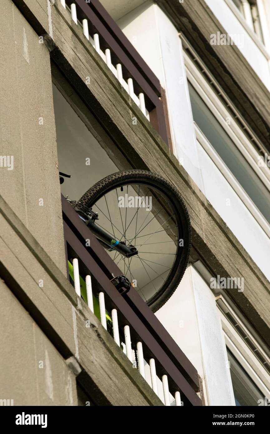 A bicycle stored on the balcony of a block of flats in the UK Stock ...