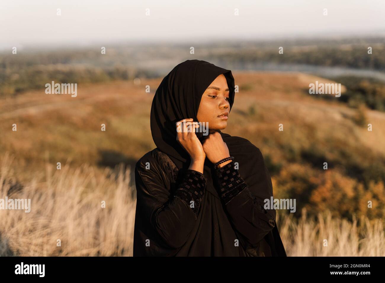 Portrait of muslim woman in black robe Stock Photo - Alamy