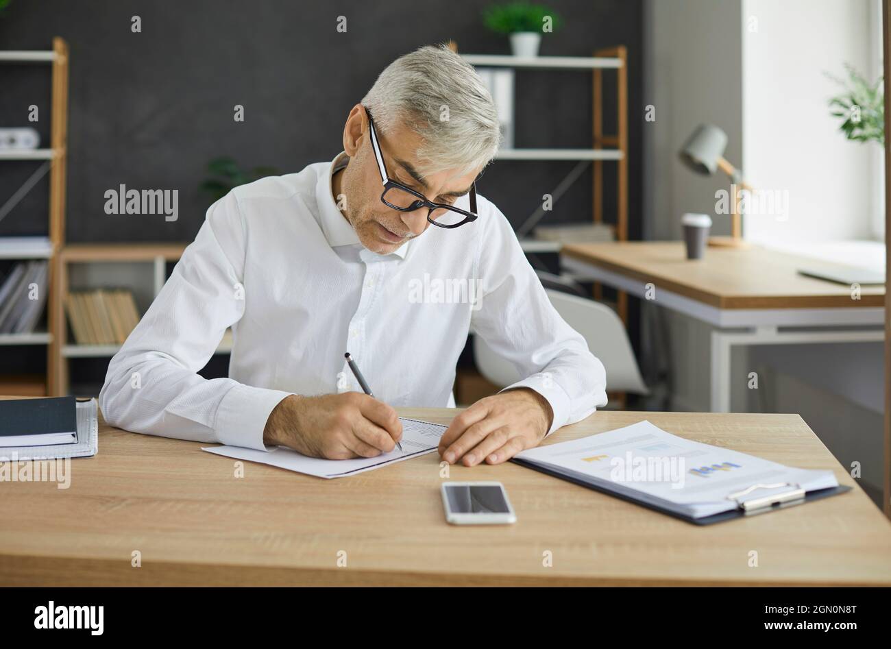 Senior businessman sitting notebook hi-res stock photography and images ...