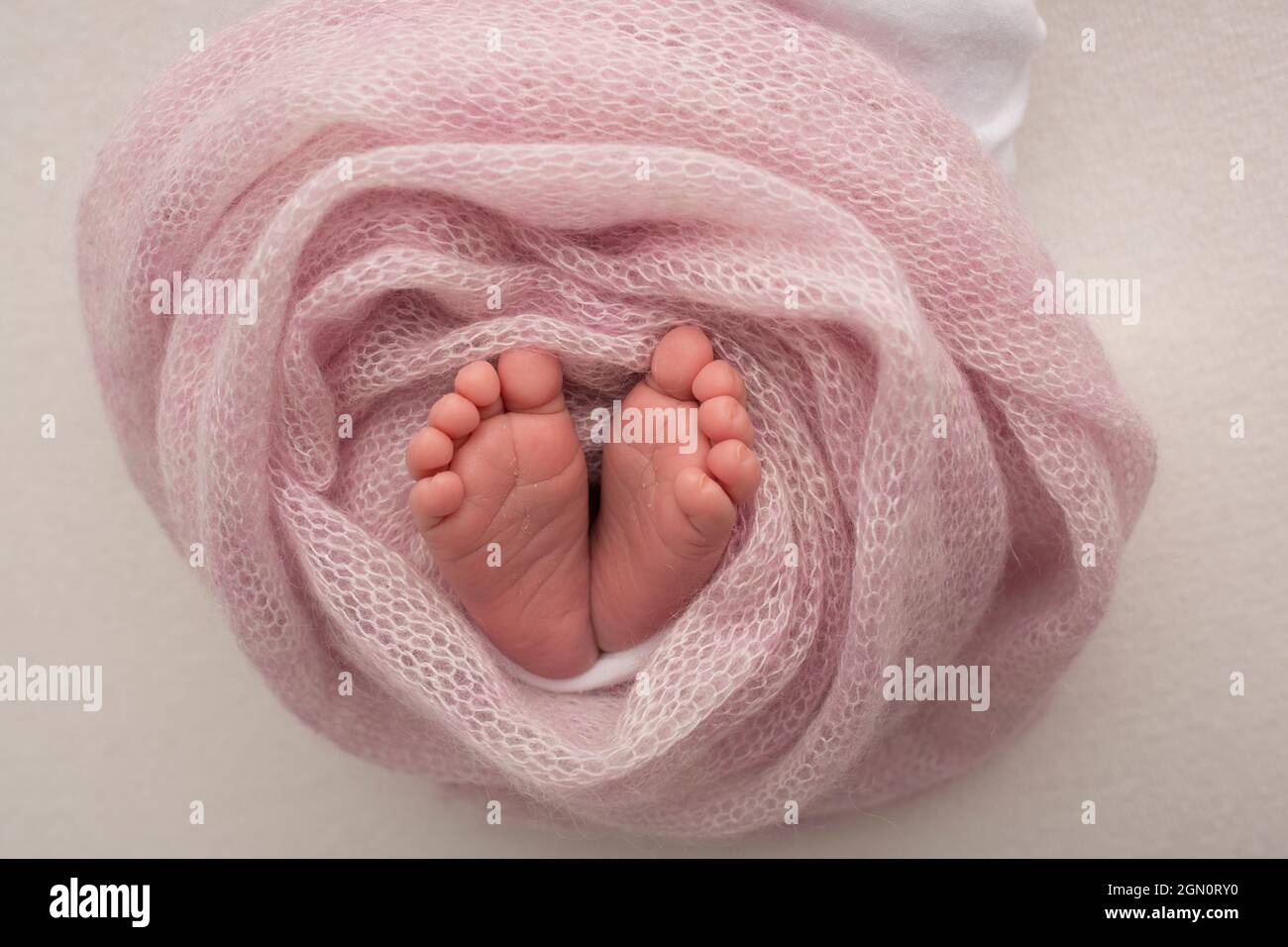 Close up picture of new born baby feet on a pink plaid Stock Photo - Alamy
