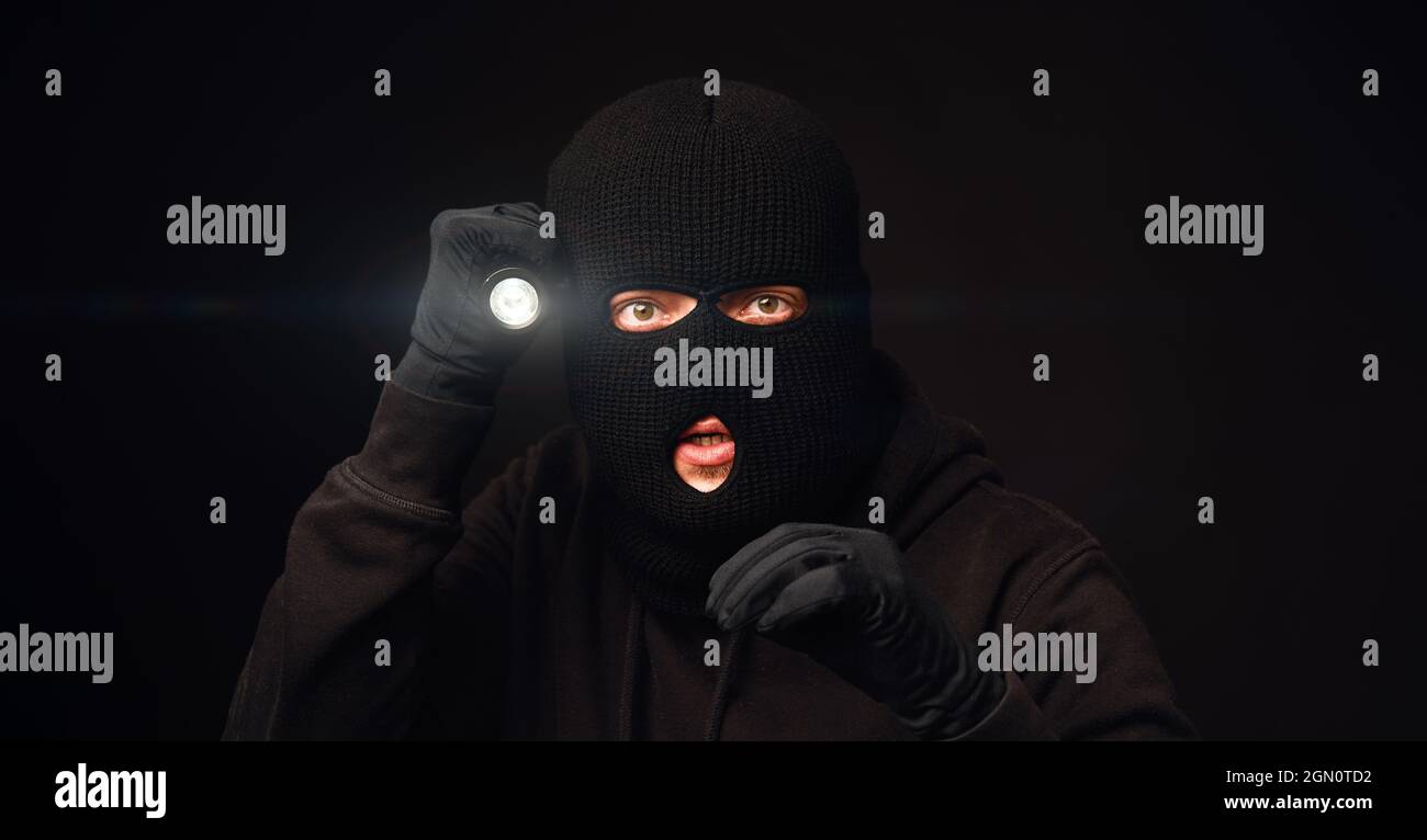 Masked man on dark hi-res stock photography and images - Alamy