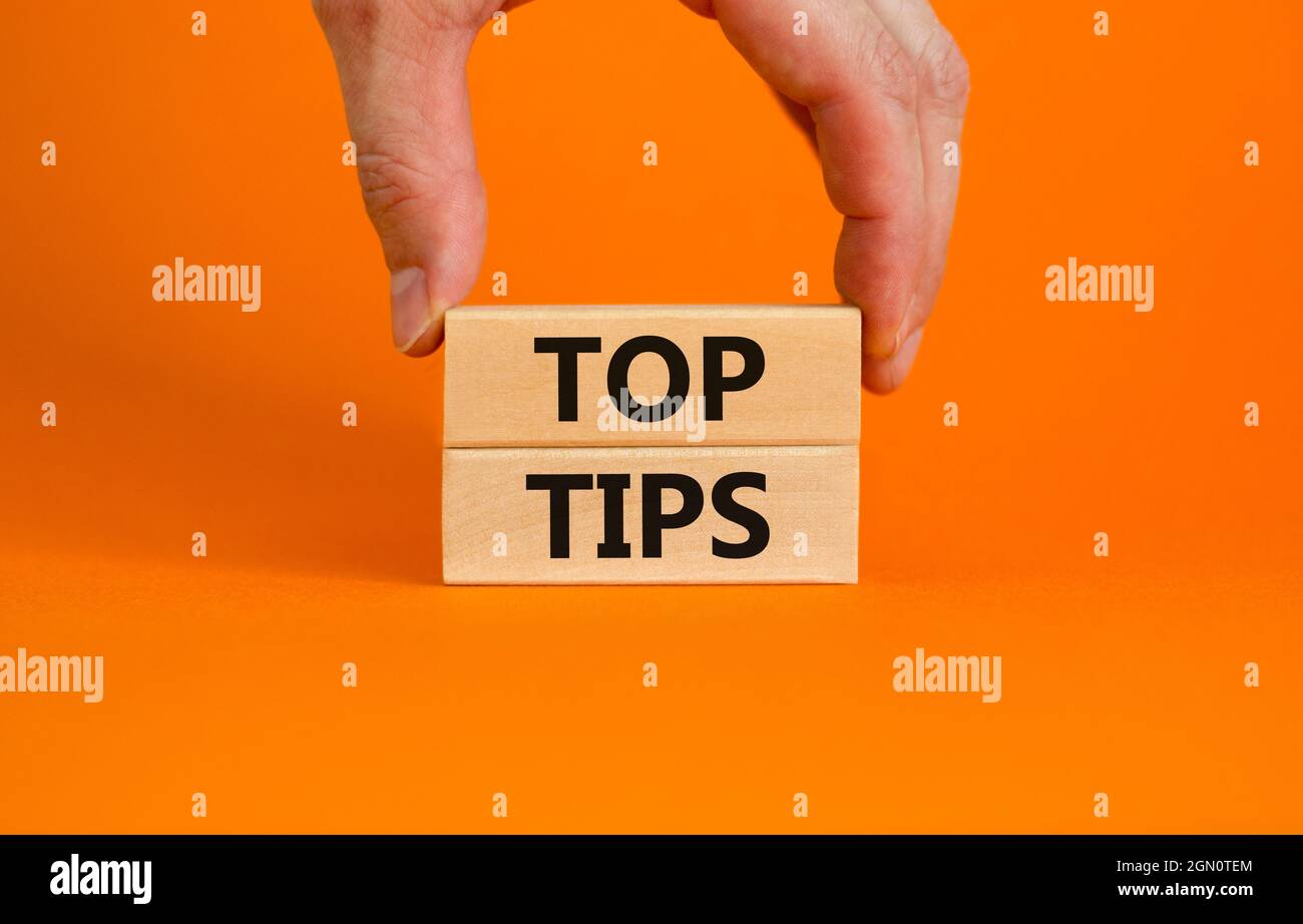 Top tips symbol. Concept words Top tips on wooden blocks on a beautiful ...