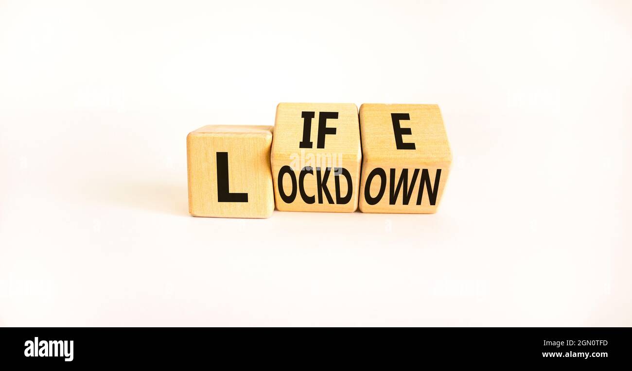 Life with lockdown symbol. Turned wooden cubes and changed words ...
