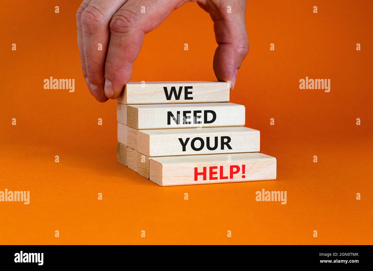 We need your help symbol. Wooden blocks with concept words 'We need ...