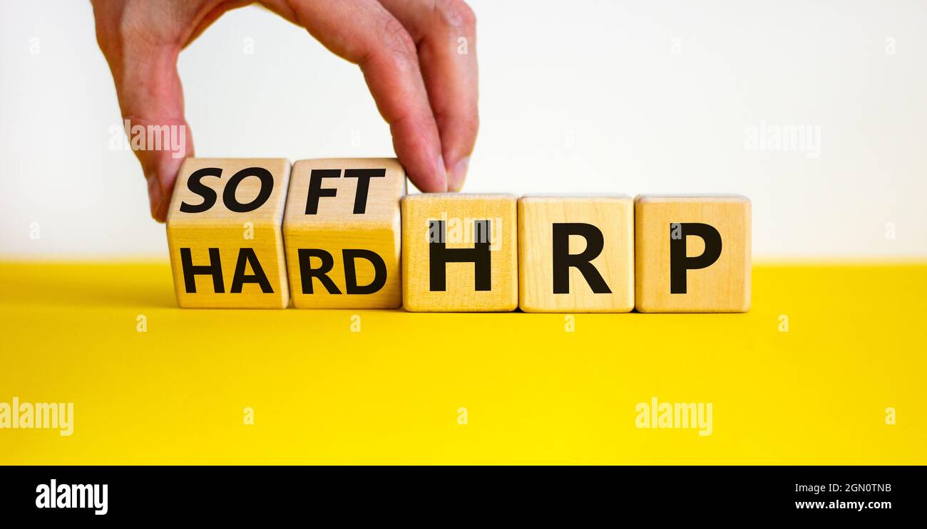 HRP, human resource planning symbol. Businessman turns wooden cubes and ...