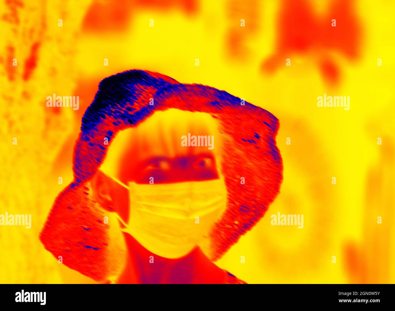 Portrait girl with tense eyes in protective mask. The tense atmosphere ...