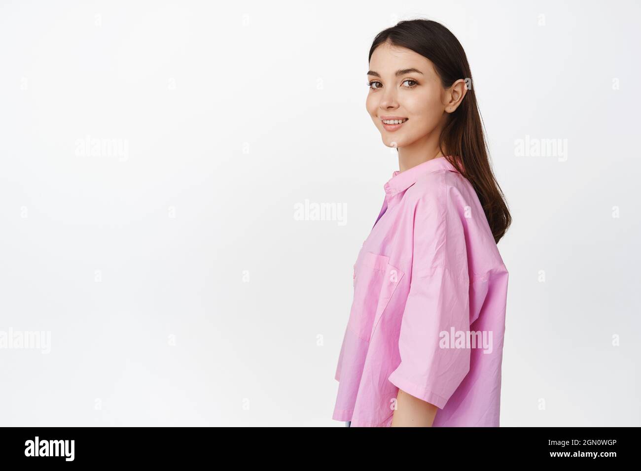 People and lifestyle. Portrait of young female model turn head at ...