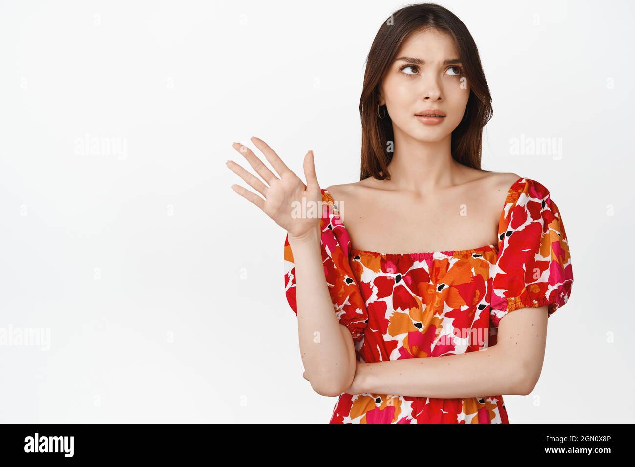 Arrogantbrunette woman roll her eyes annoyed, rejecting offer, waving ...