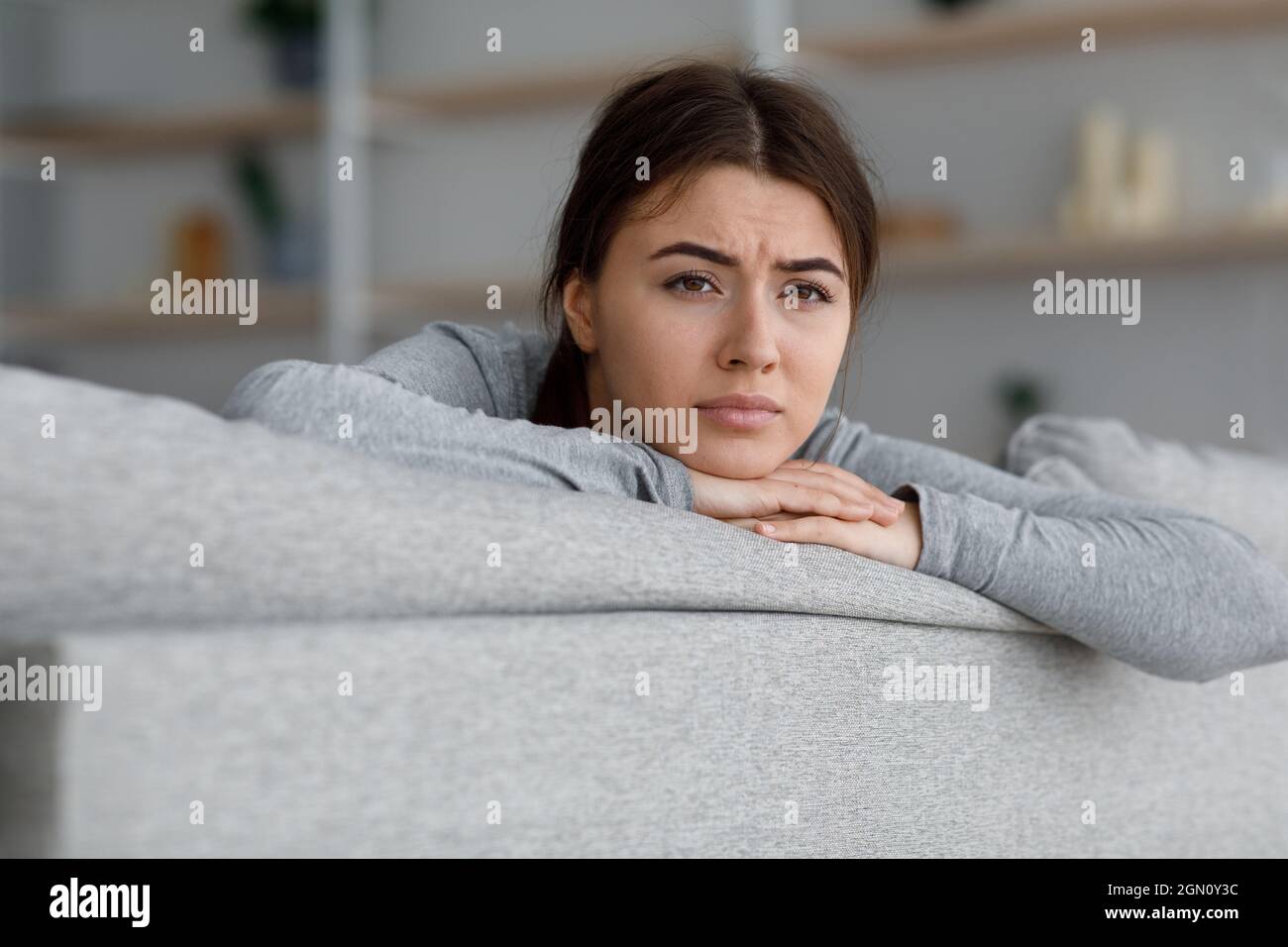 Pensive upset sad european young female suffering from depression ...