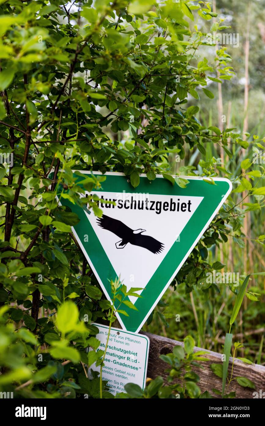 German nature reserve shield surrounded by green vegetation Stock Photo ...